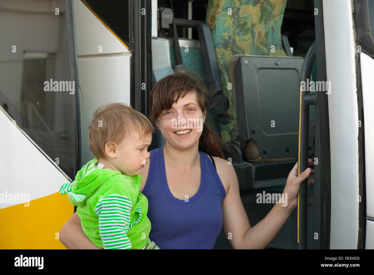 Mother and child traveling on commercial bus Stock Photo - Alamy