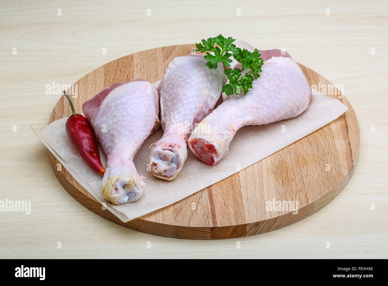 Raw chicken legs with parsley ready for cooking Stock Photo - Alamy