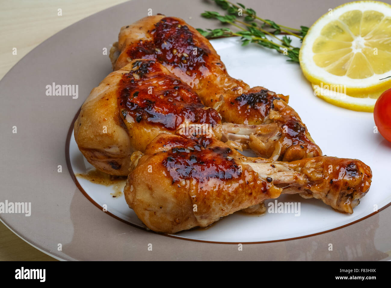 Roasted chicken legs in teriyaki sause with thyme Stock Photo - Alamy