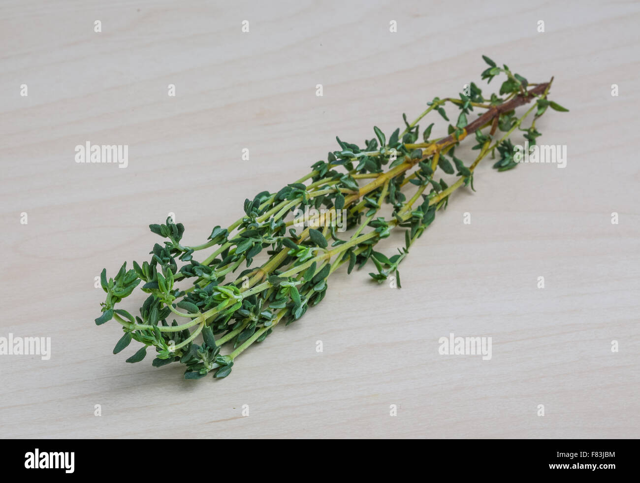 Fresh green Thyme branchon the wood background Stock Photo - Alamy