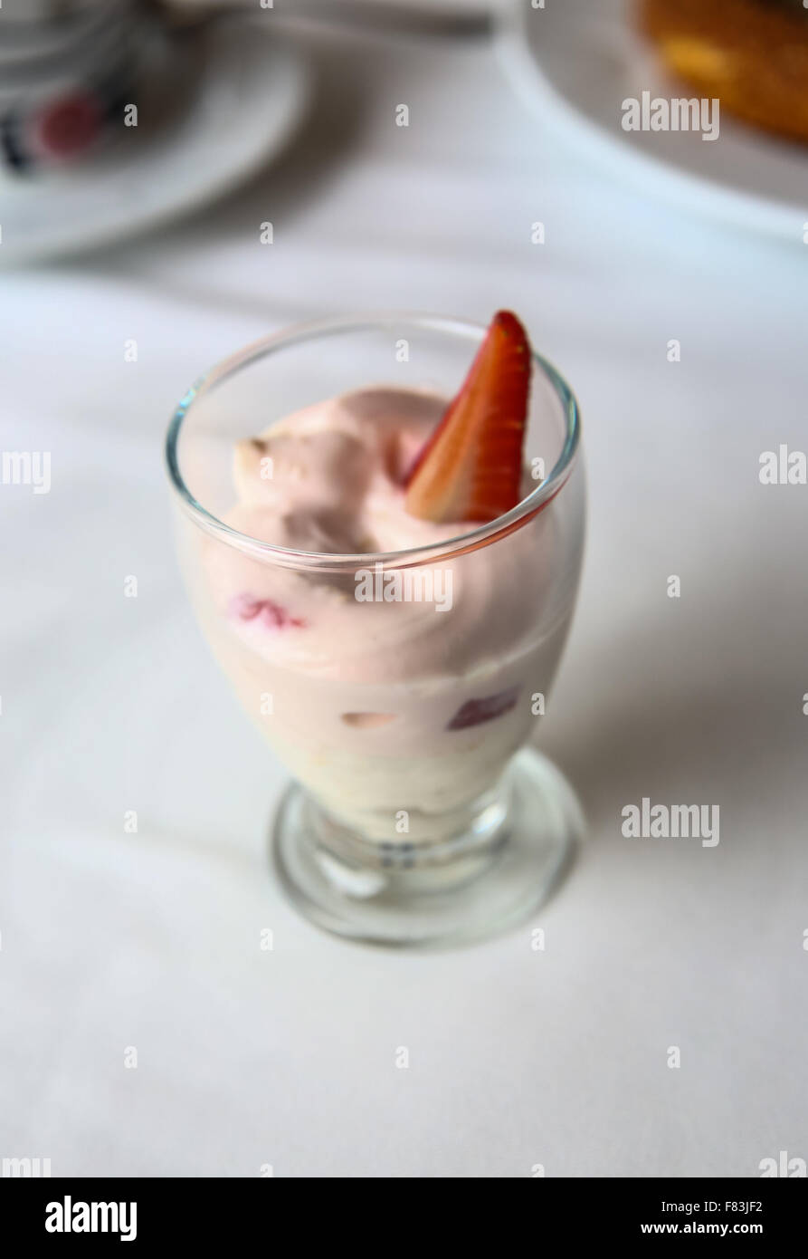 Pink Yoghurt with fresh red strawberry slice Stock Photo - Alamy