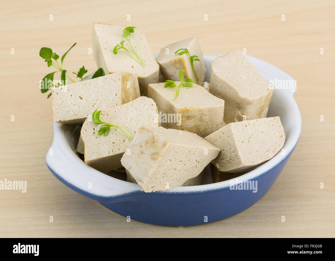 Tofu - soya cheese with herbs on the wood background Stock Photo - Alamy