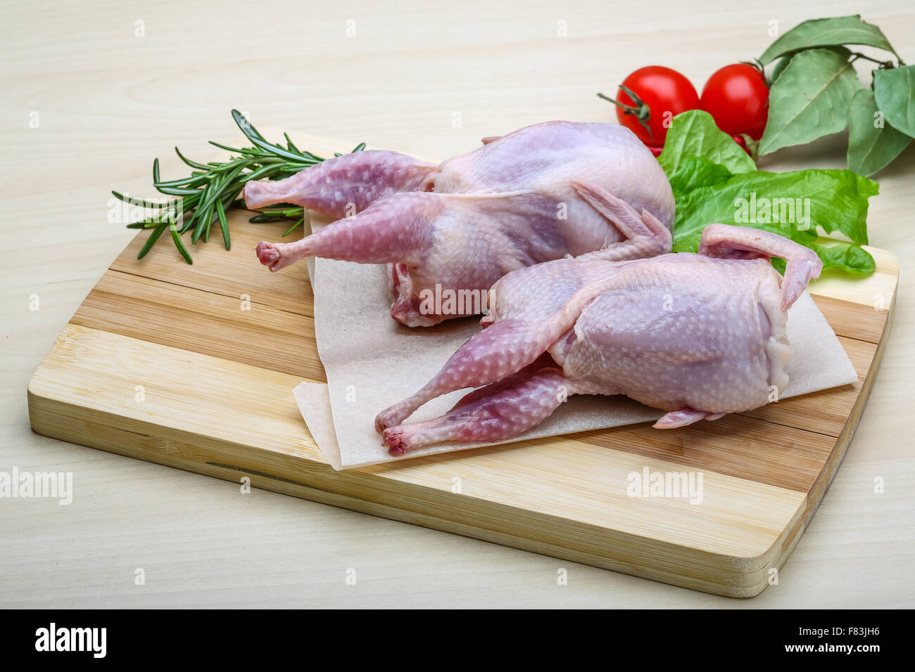 Raw quail with herbs ready for cooking Stock Photo - Alamy