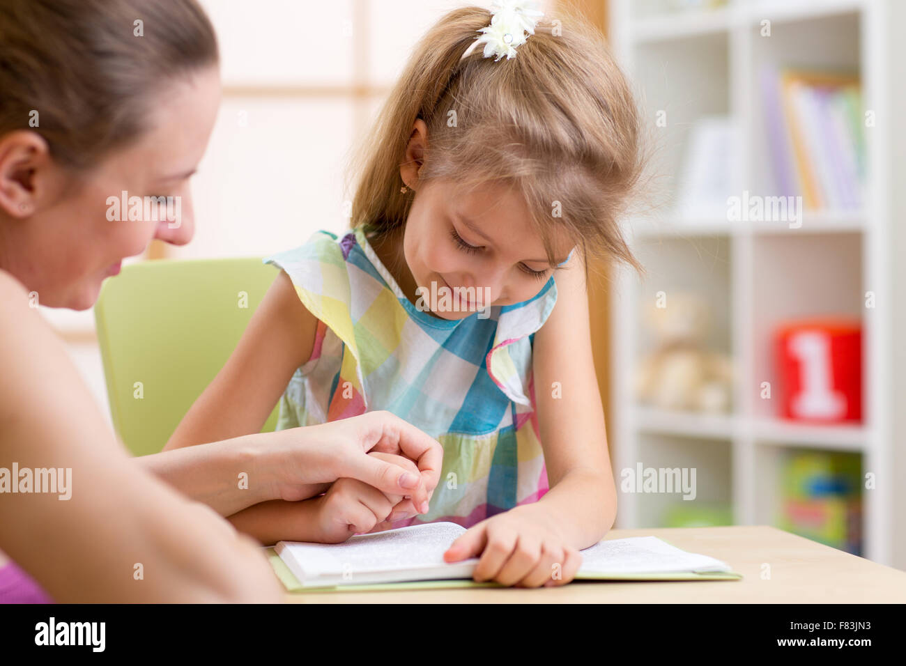 Preschool teacher reading book class hi-res stock photography and ...