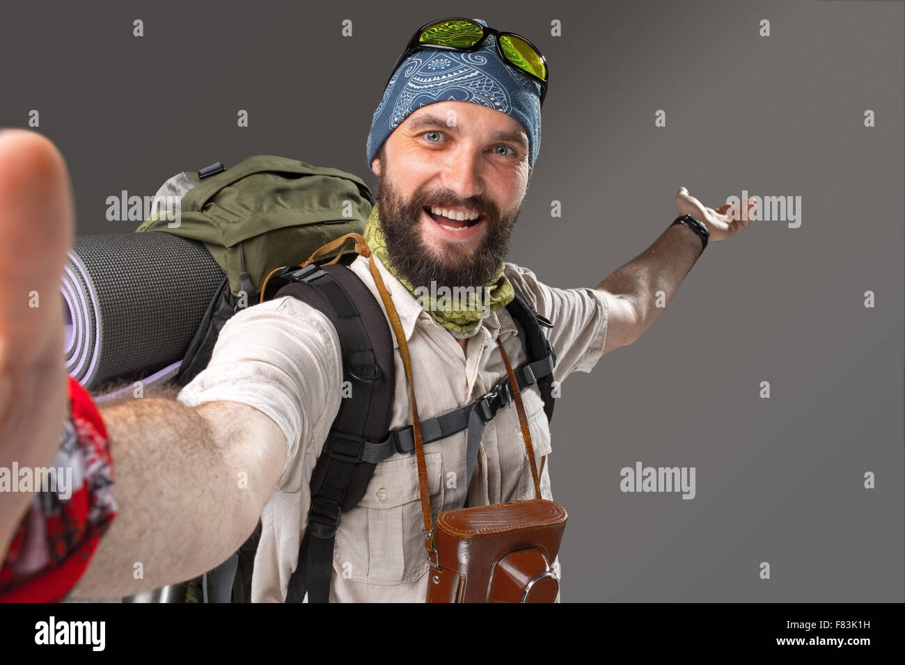 Portrait of a smiling male fully equipped tourist Stock Photo - Alamy