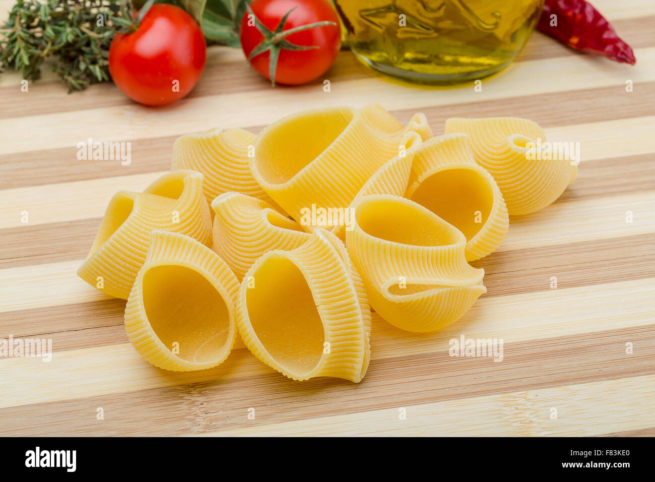Pipe rigate pasta on the wood background Stock Photo - Alamy