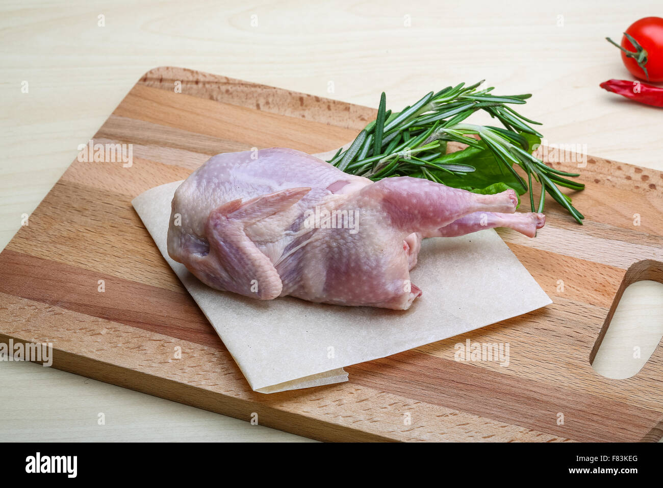 Raw quail with herbs ready for cooking Stock Photo - Alamy