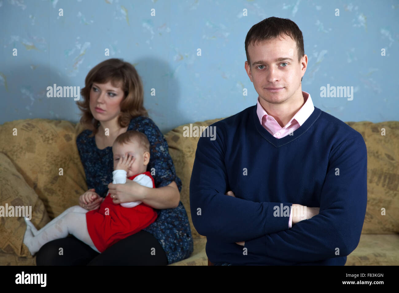 Family of three having quarrel at home Stock Photo - Alamy