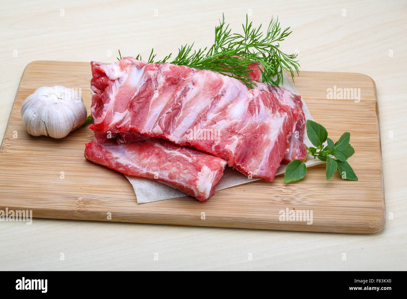 Raw pork ribs with dill - ready for cooking Stock Photo - Alamy