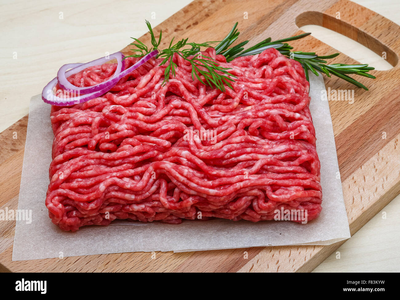Raw beef minced meat with rosemary and onion Stock Photo - Alamy