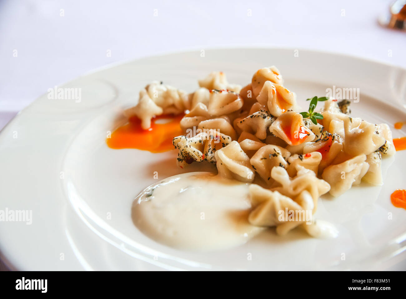 Turkish dumplings - manti with yoghurt sauce Stock Photo - Alamy