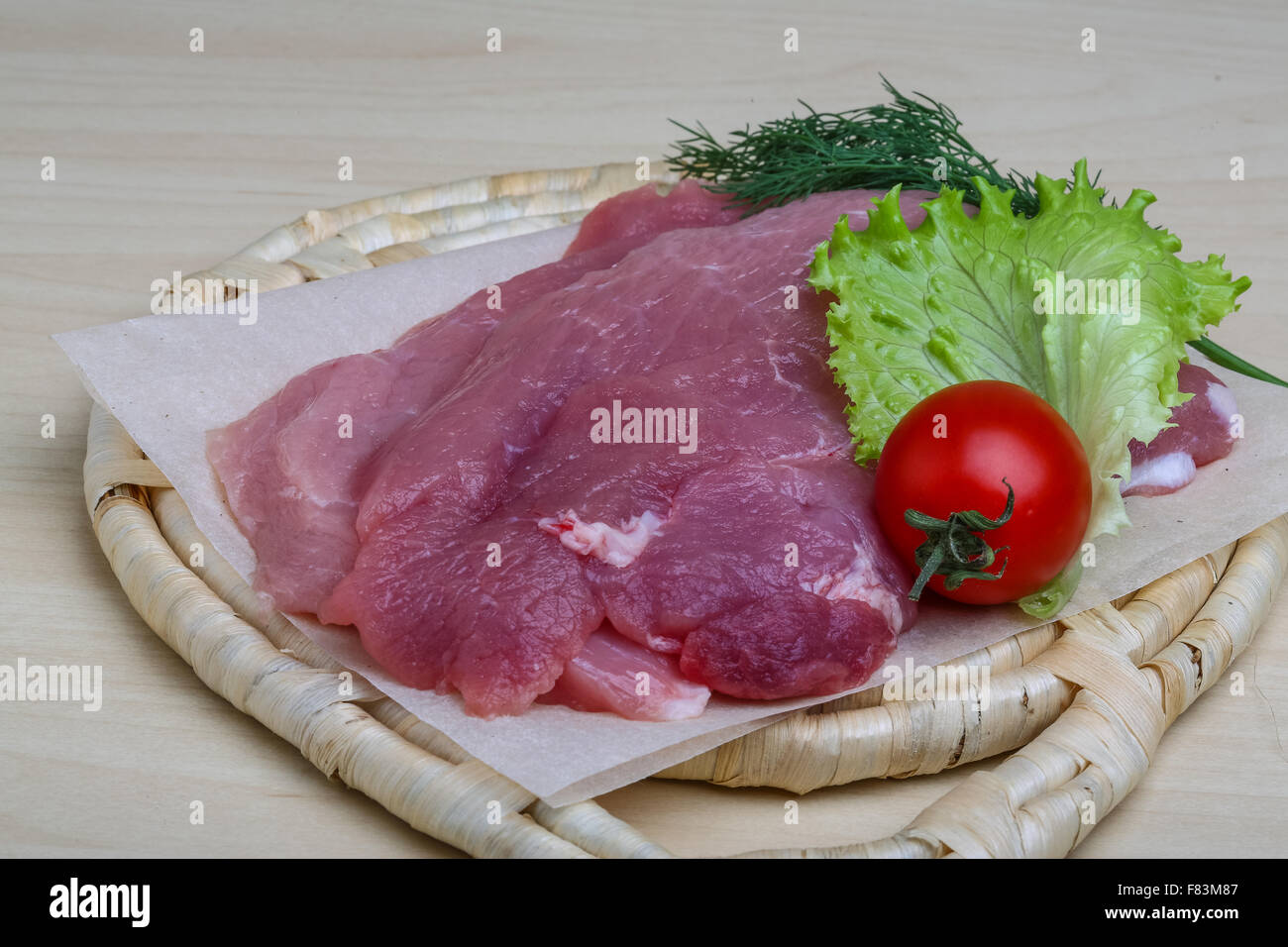 Raw pork schnitzel with dill - ready for cooking Stock Photo - Alamy