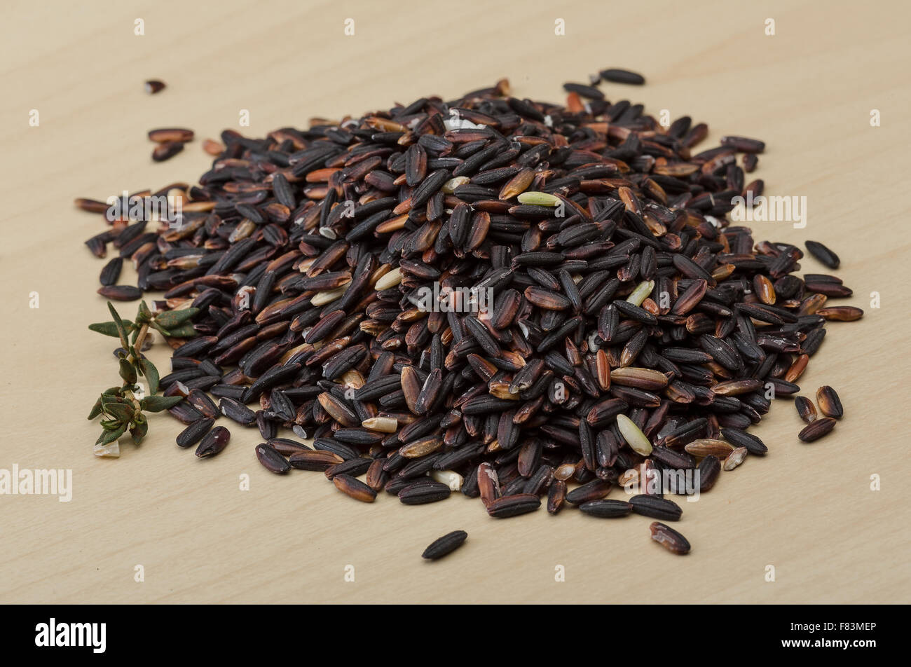 Dry wild rice mix heap on the wood background Stock Photo - Alamy