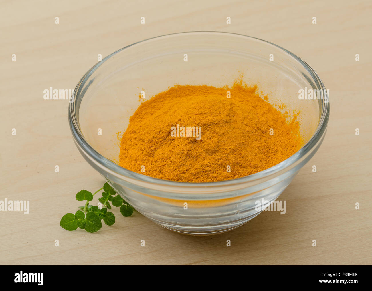 Yellow Tumeric powder in the glass bowl Stock Photo - Alamy