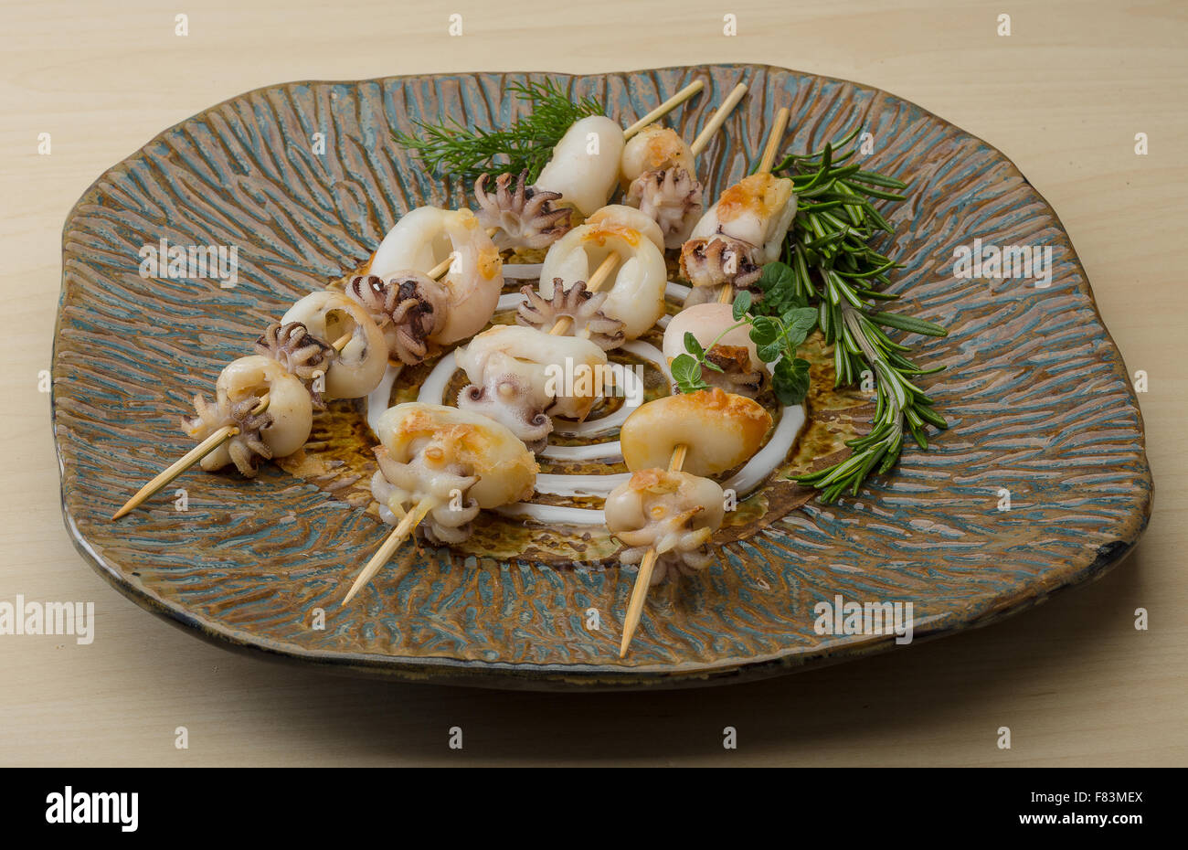 Grilled cuttlefish bbq with rosemary and pepper Stock Photo - Alamy