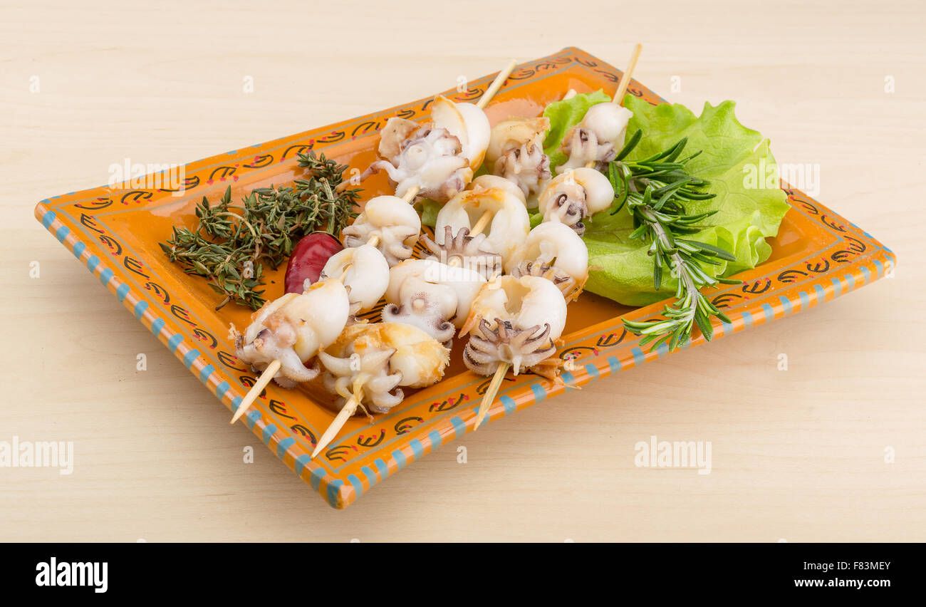 Grilled cuttlefish bbq with rosemary and pepper Stock Photo - Alamy