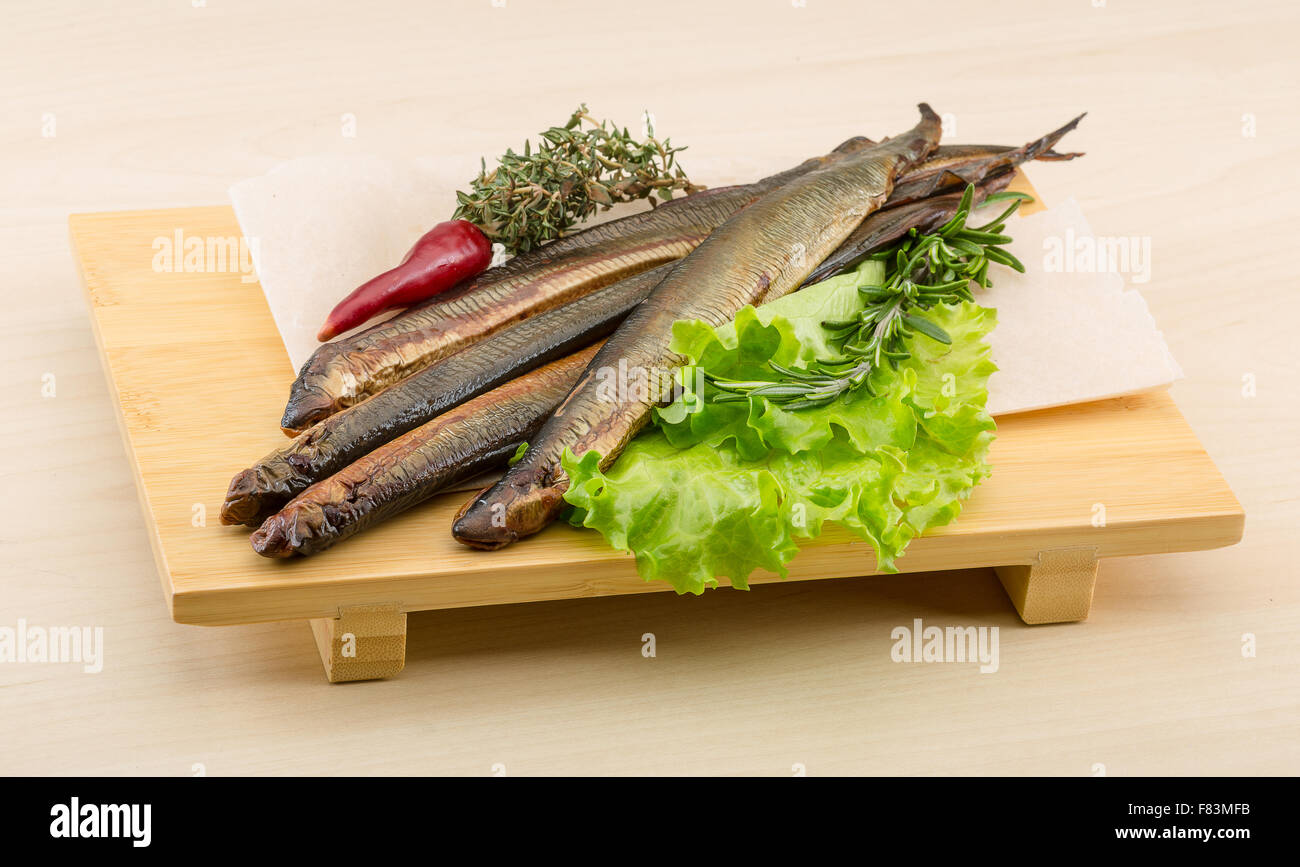 Smoked Lamprey - seafood delicacy with salad and herbs Stock Photo - Alamy