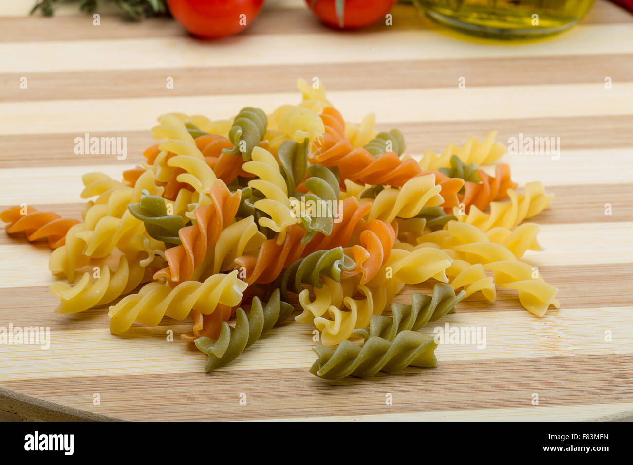 Raw fusilli pasta on the wood background Stock Photo - Alamy