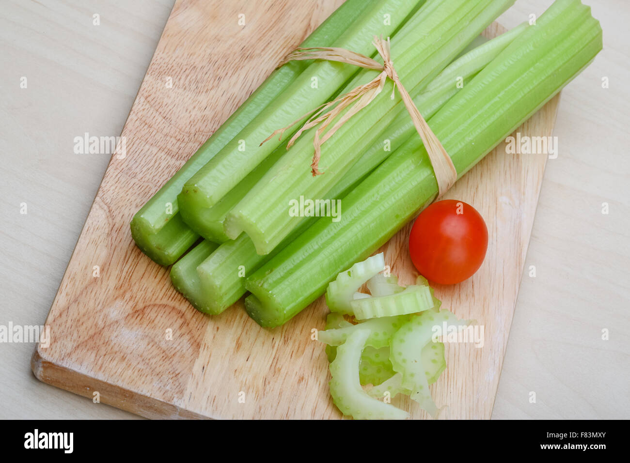 Fresh Green Celery sticks on the wood background Stock Photo - Alamy