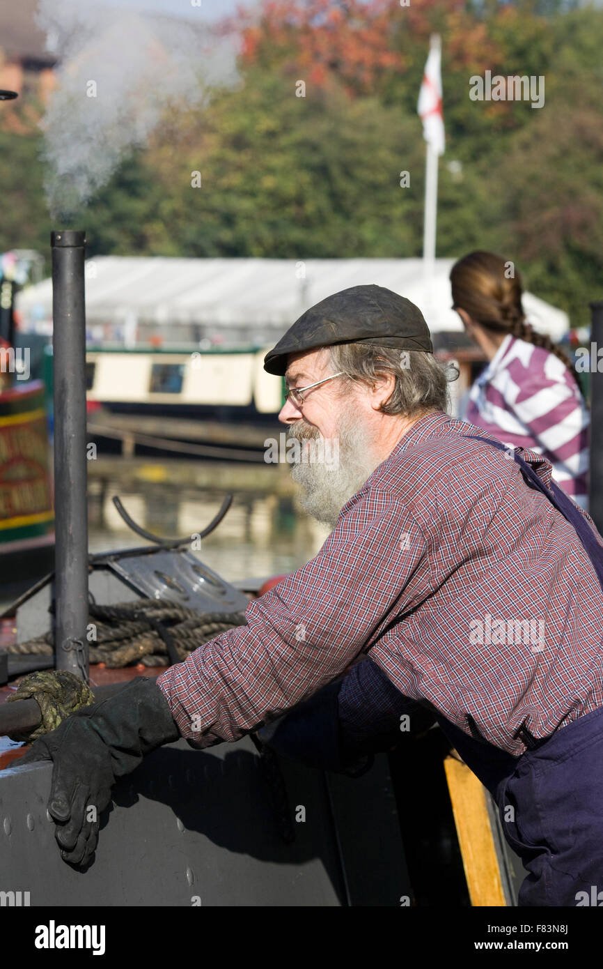 Man working on his Narrow boat Stock Photo - Alamy