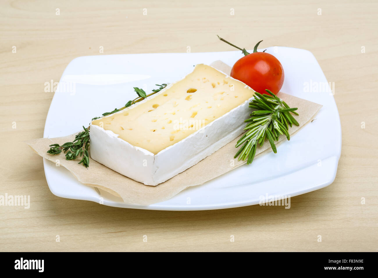 Soft brie cheese with rosemary, thyme and toast bread Stock Photo - Alamy