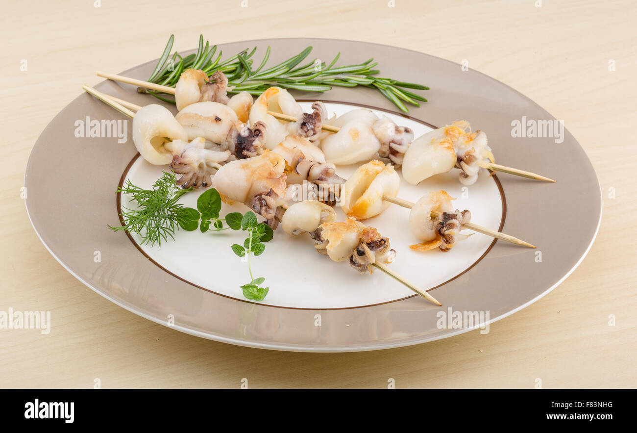 Grilled cuttlefish bbq with rosemary and pepper Stock Photo - Alamy