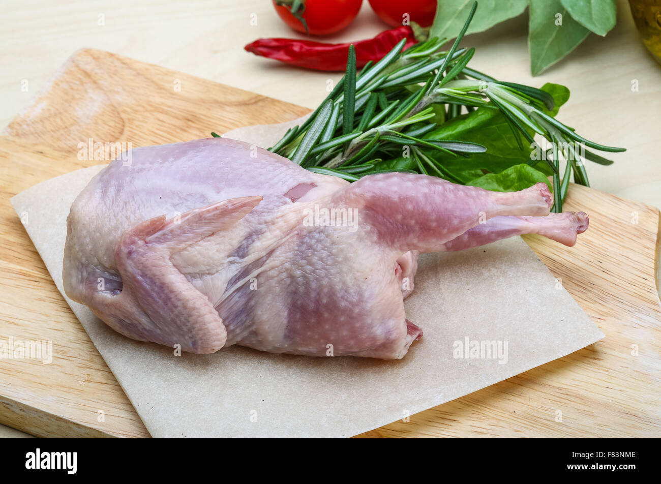 Raw quail with herbs ready for cooking Stock Photo - Alamy