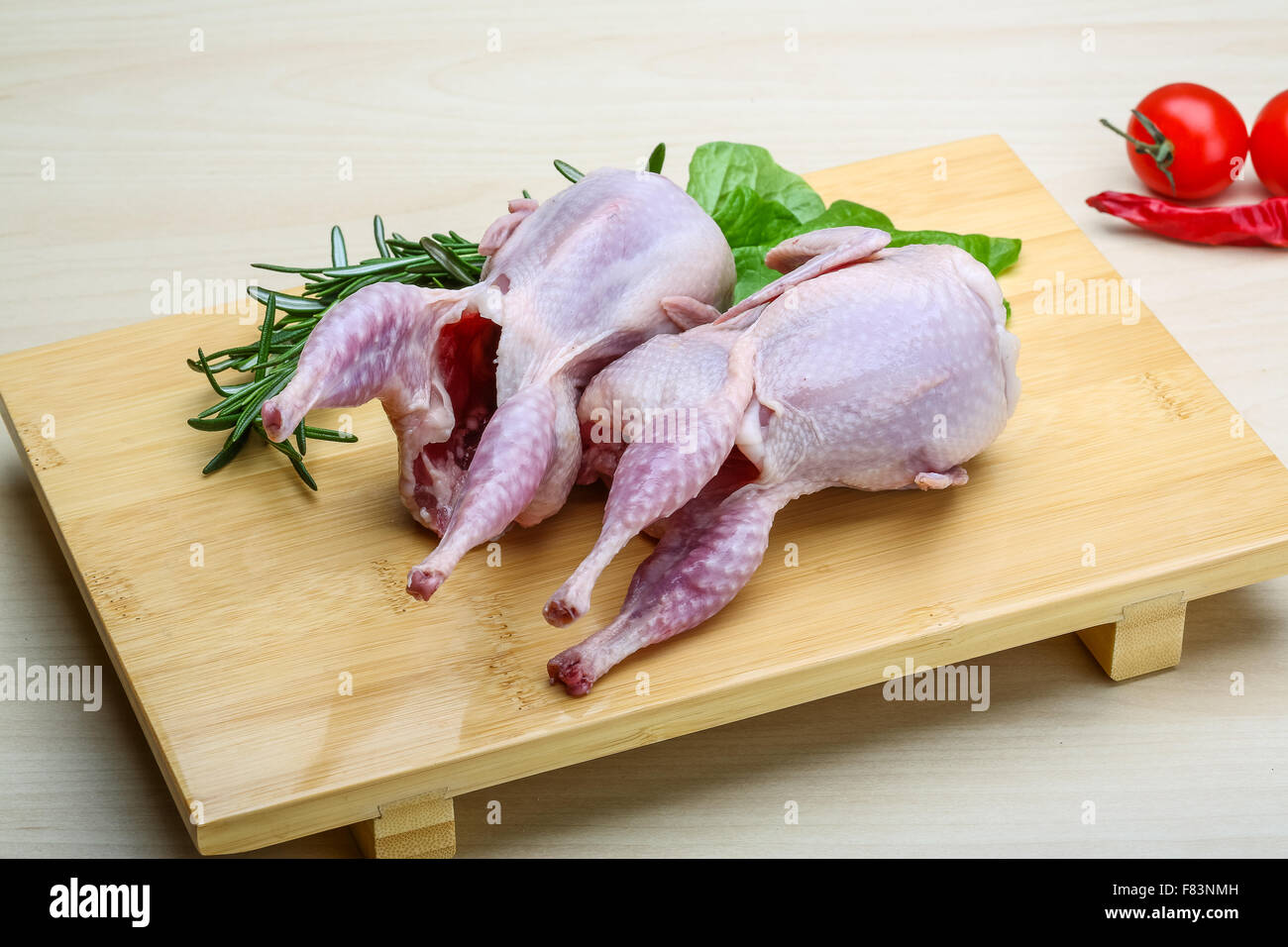 Raw quail with herbs ready for cooking Stock Photo - Alamy