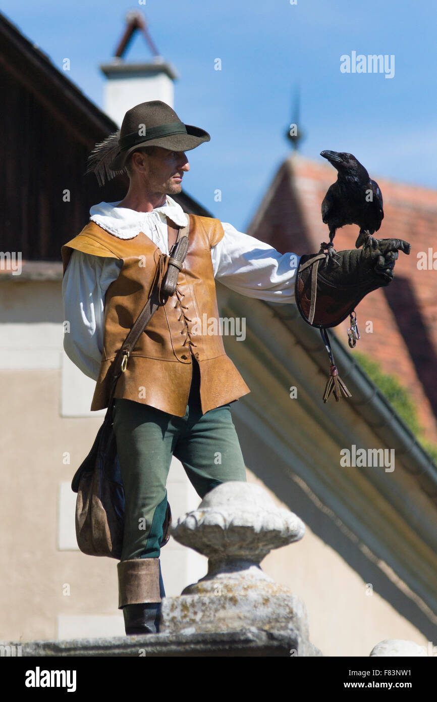 A common raven and falconer at Rosenberg Renaissance Castle Stock Photo ...