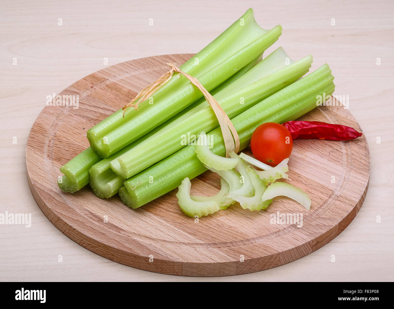 Fresh Green Celery sticks on the wood background Stock Photo - Alamy