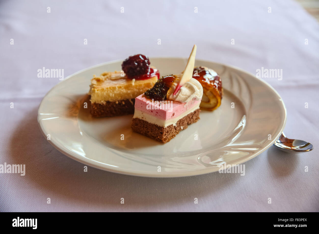 Mini cakes with berries and sweet cream Stock Photo - Alamy