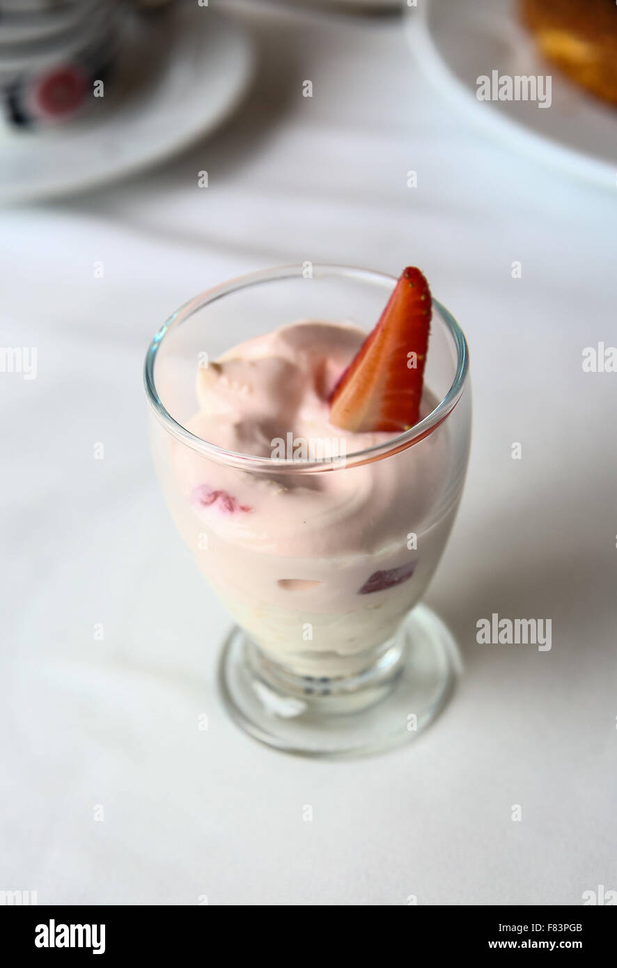 Pink Yoghurt with fresh red strawberry slice Stock Photo - Alamy