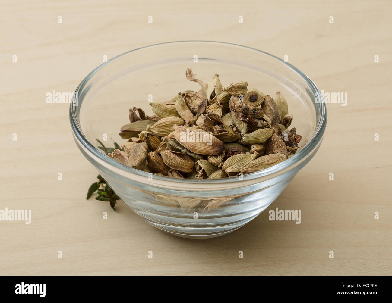 Dry Cardamom heap on the wood background Stock Photo - Alamy