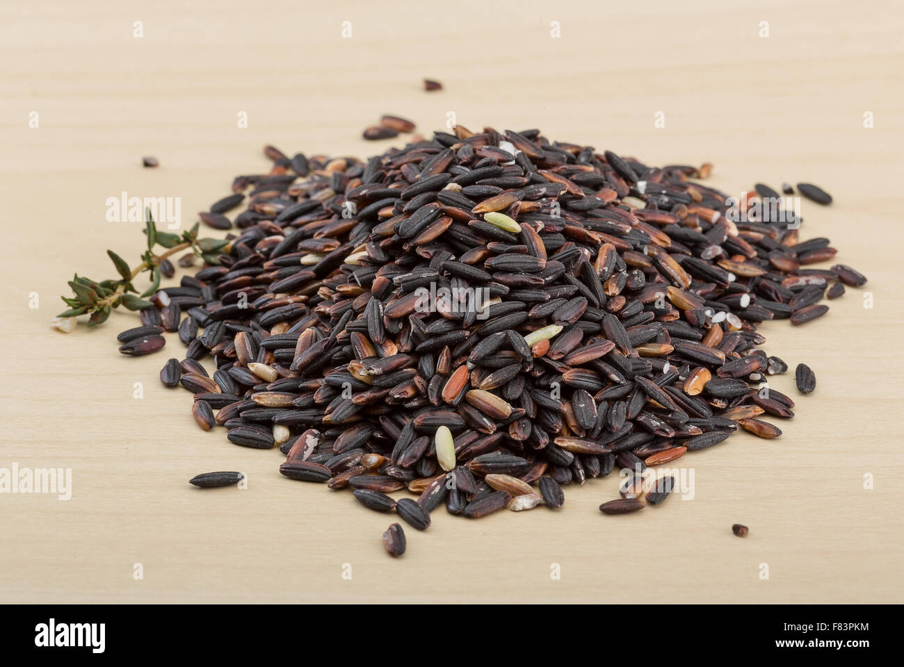 Dry wild rice mix heap on the wood background Stock Photo - Alamy