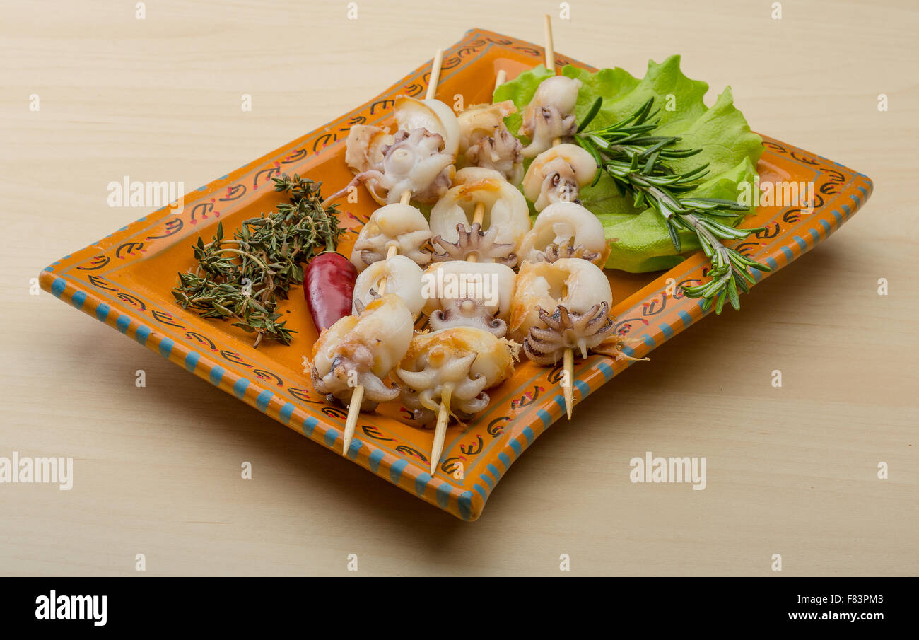 Grilled cuttlefish bbq with rosemary and pepper Stock Photo - Alamy