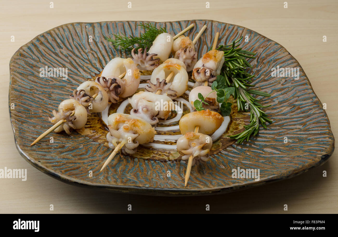 Grilled cuttlefish bbq with rosemary and pepper Stock Photo - Alamy