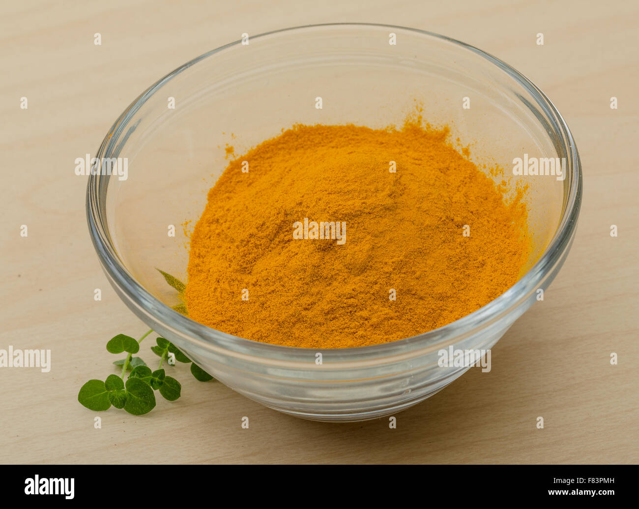 Yellow Tumeric powder in the glass bowl Stock Photo - Alamy