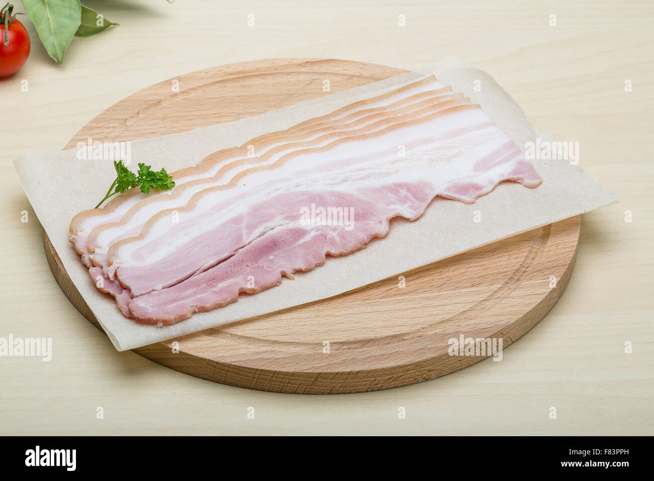 Raw Bacon strips on the wood background Stock Photo - Alamy