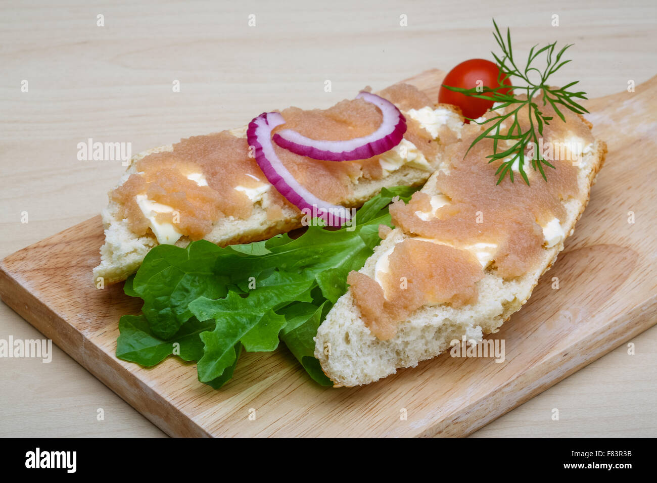 Sandwich with cod roe, salad, onion and dill Stock Photo - Alamy