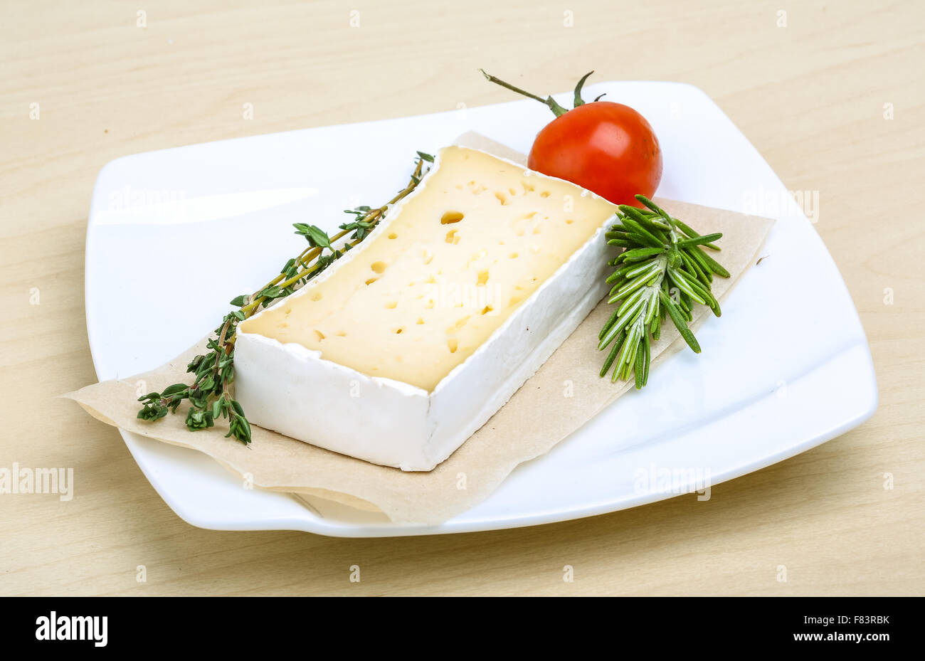 Soft brie cheese with rosemary, thyme and toast bread Stock Photo - Alamy