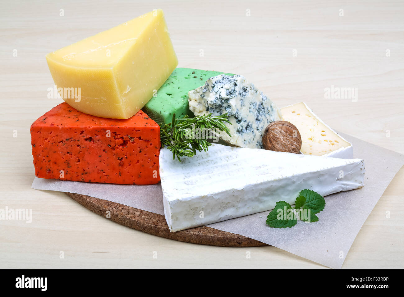 Assortment cheese with herbs on the wood background Stock Photo - Alamy