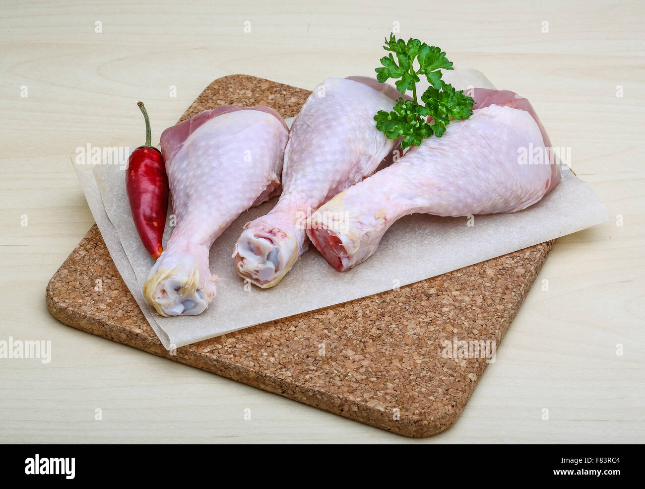 Raw chicken legs with parsley ready for cooking Stock Photo - Alamy