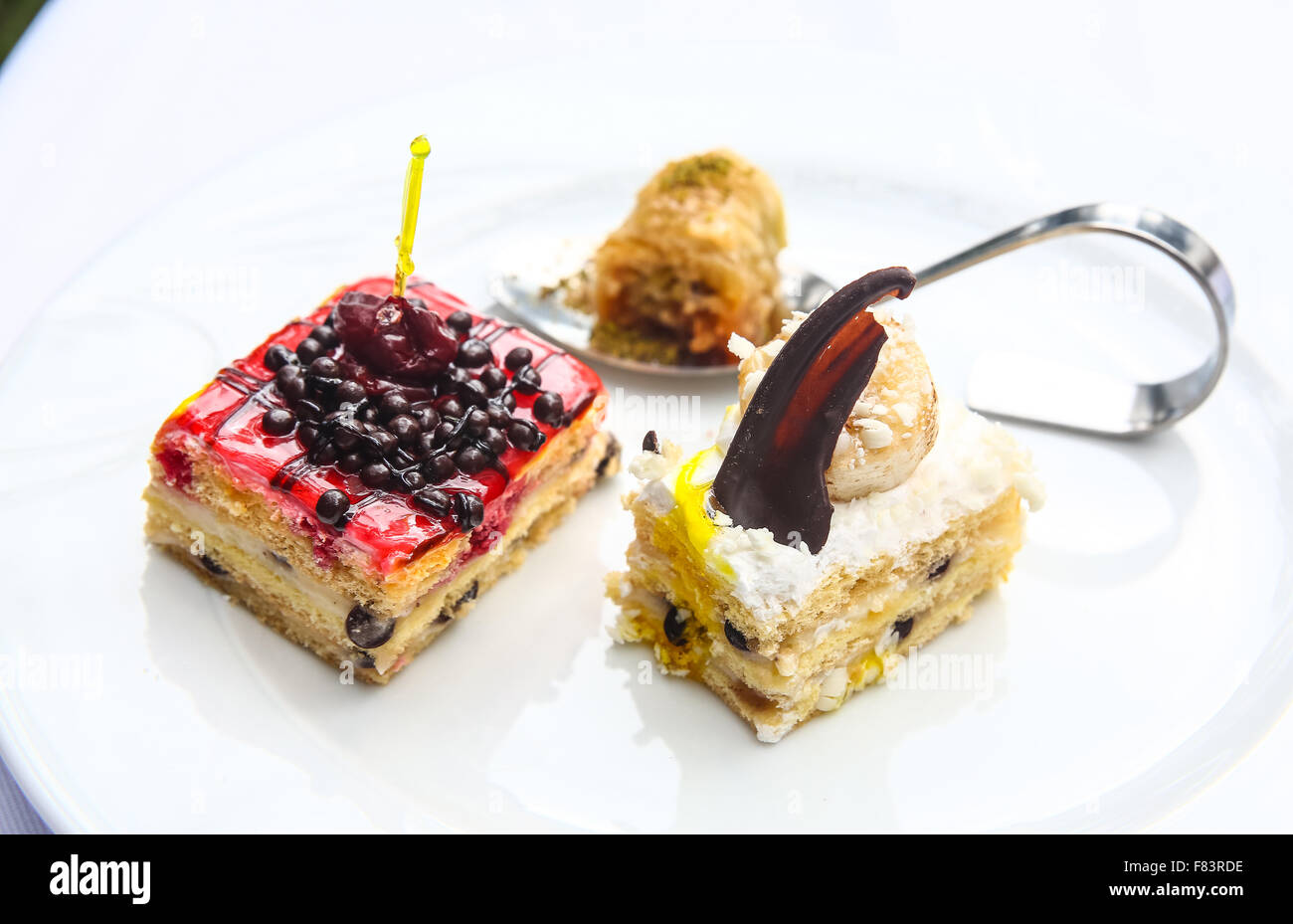 Mini cakes with berries and sweet cream Stock Photo - Alamy