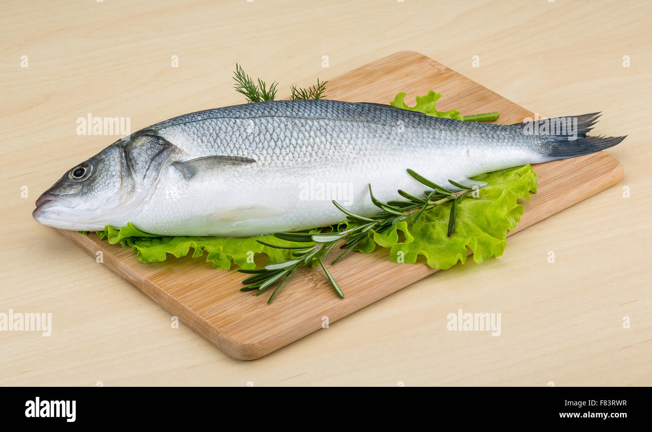 Raw seabass fish with rosemary and dill Stock Photo - Alamy