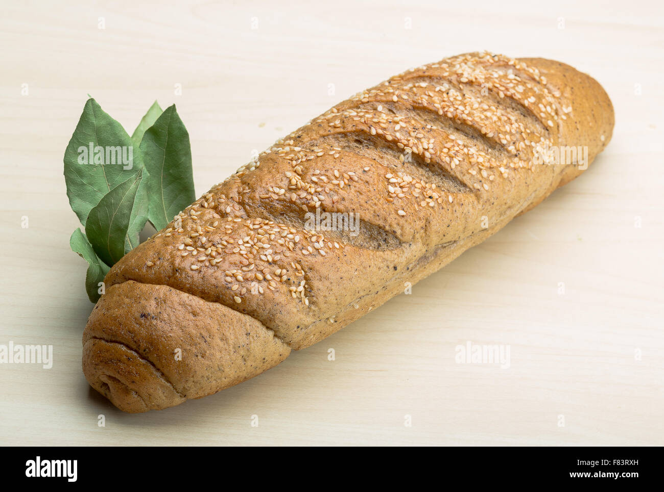 Bread - loaf with seeds and spices leaves Stock Photo - Alamy