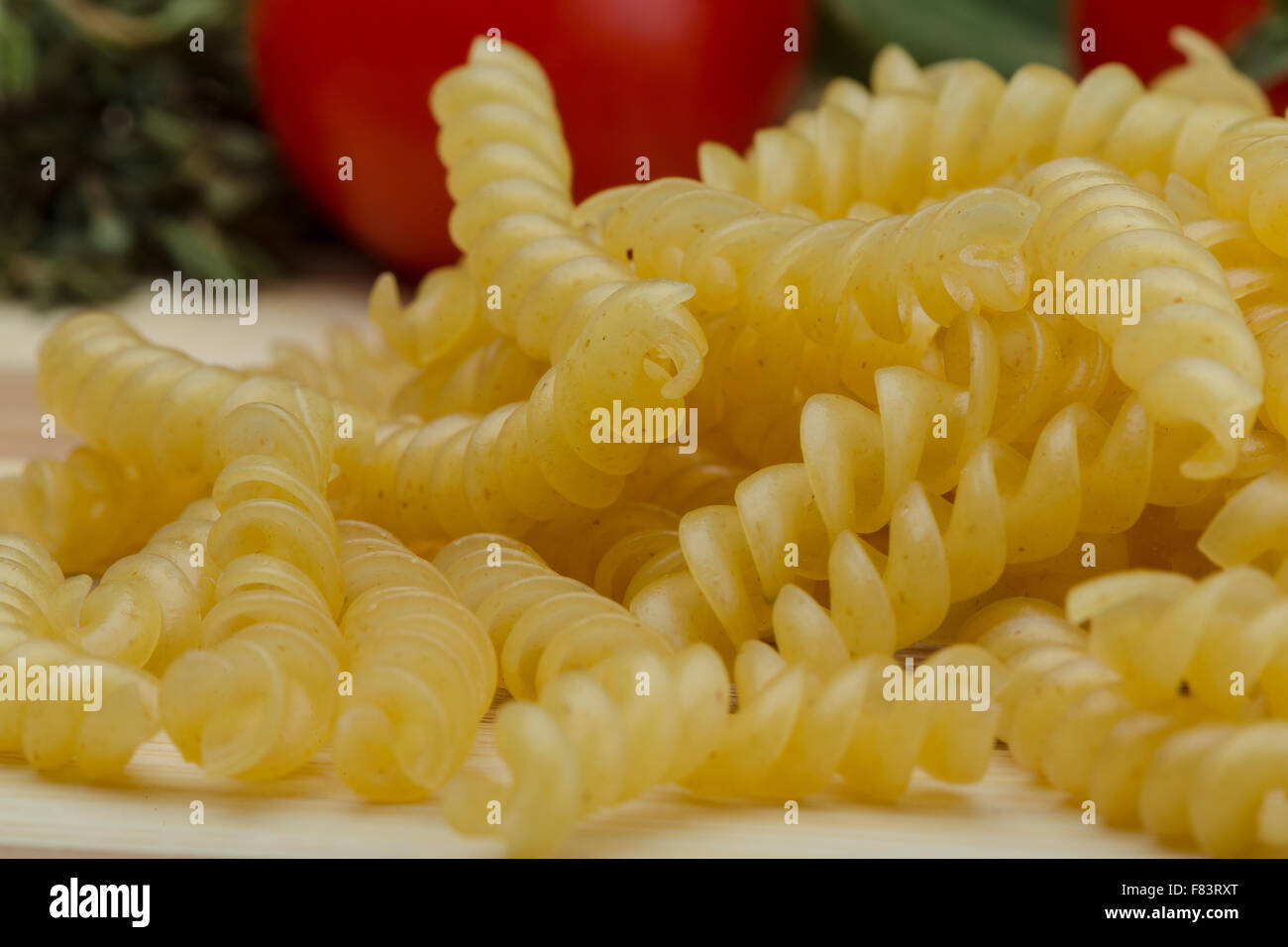 Raw rotini pasta on the wood background Stock Photo - Alamy