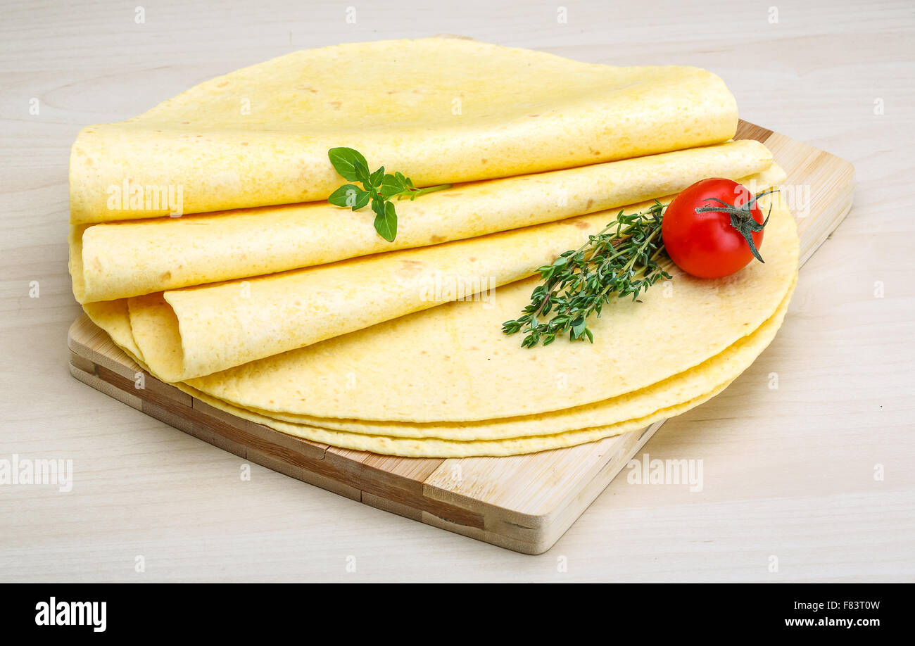 Tortilla stack with herbs on the wood background Stock Photo - Alamy