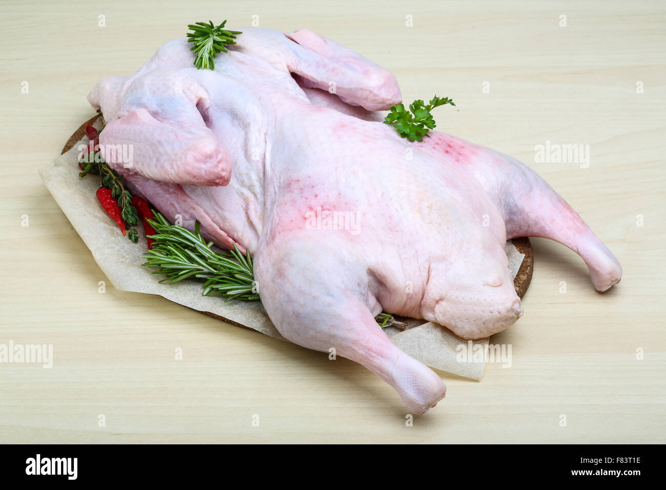 Raw duck with rosemary and spices - ready for cooking Stock Photo - Alamy