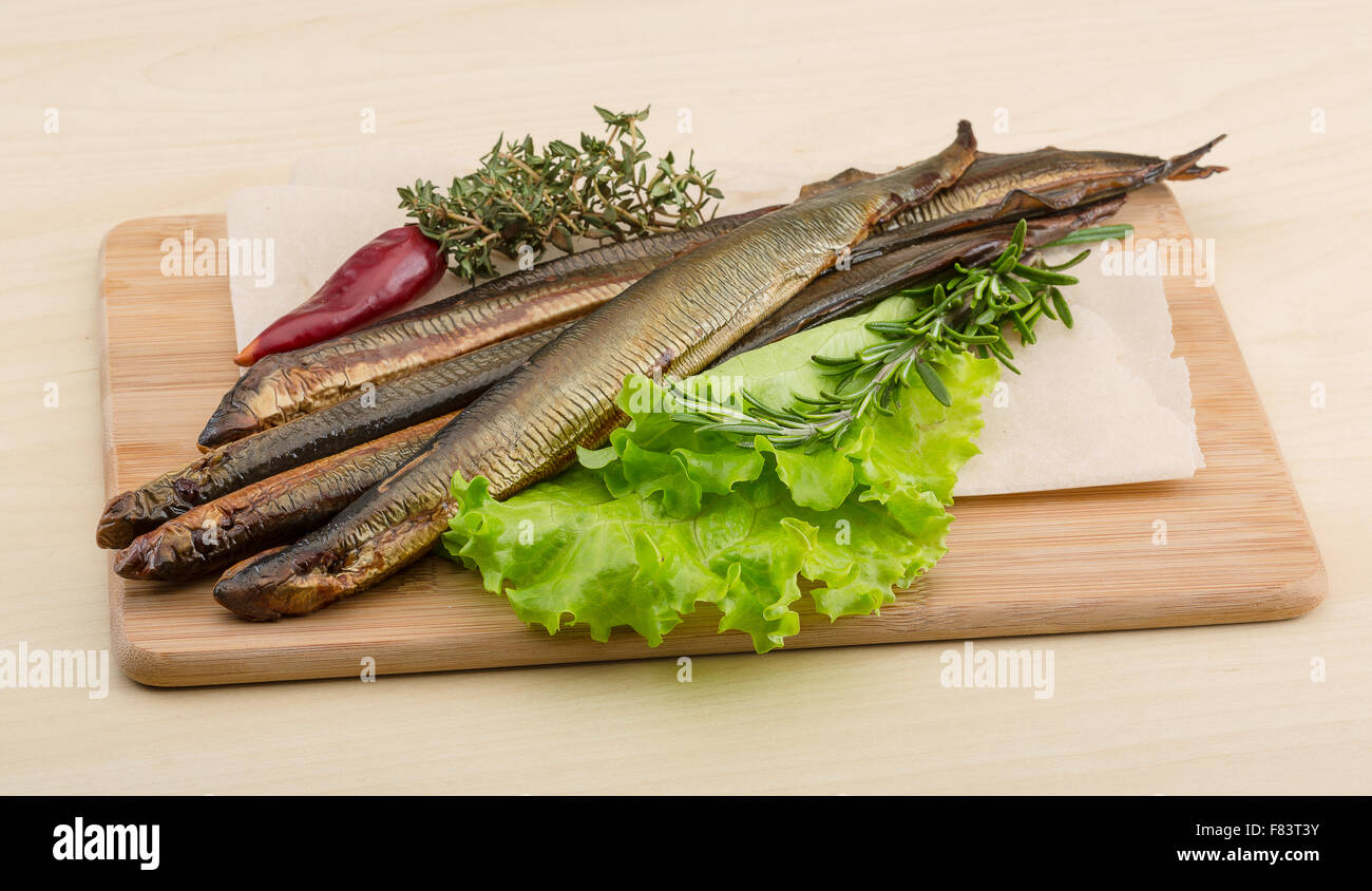 Smoked Lamprey - seafood delicacy with salad and herbs Stock Photo - Alamy