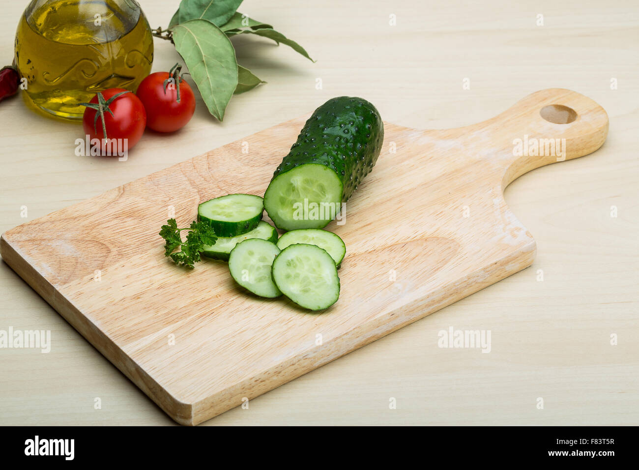 Green Sliced cucumber on the wood background Stock Photo - Alamy